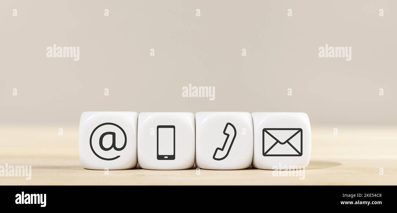 Contact us icons on white cube blocks. Copy space Stock Photo - Alamy