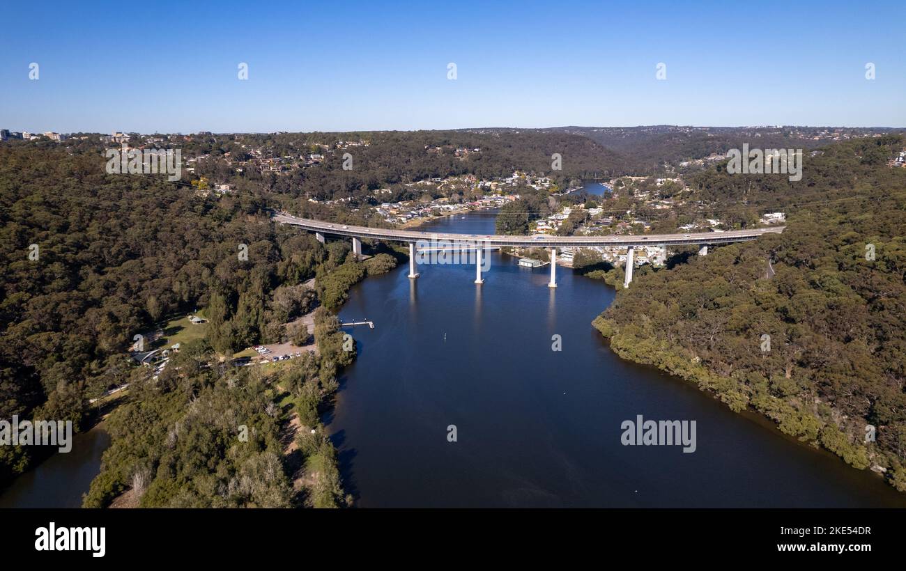 Aerial view of Woronora River surrounded by lush greenery and Woronora ...