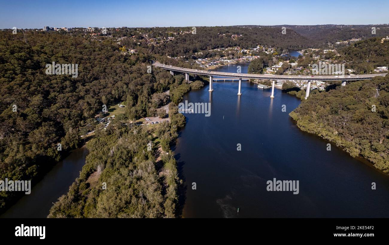 Aerial view of Woronora River surrounded by lush greenery and Woronora ...