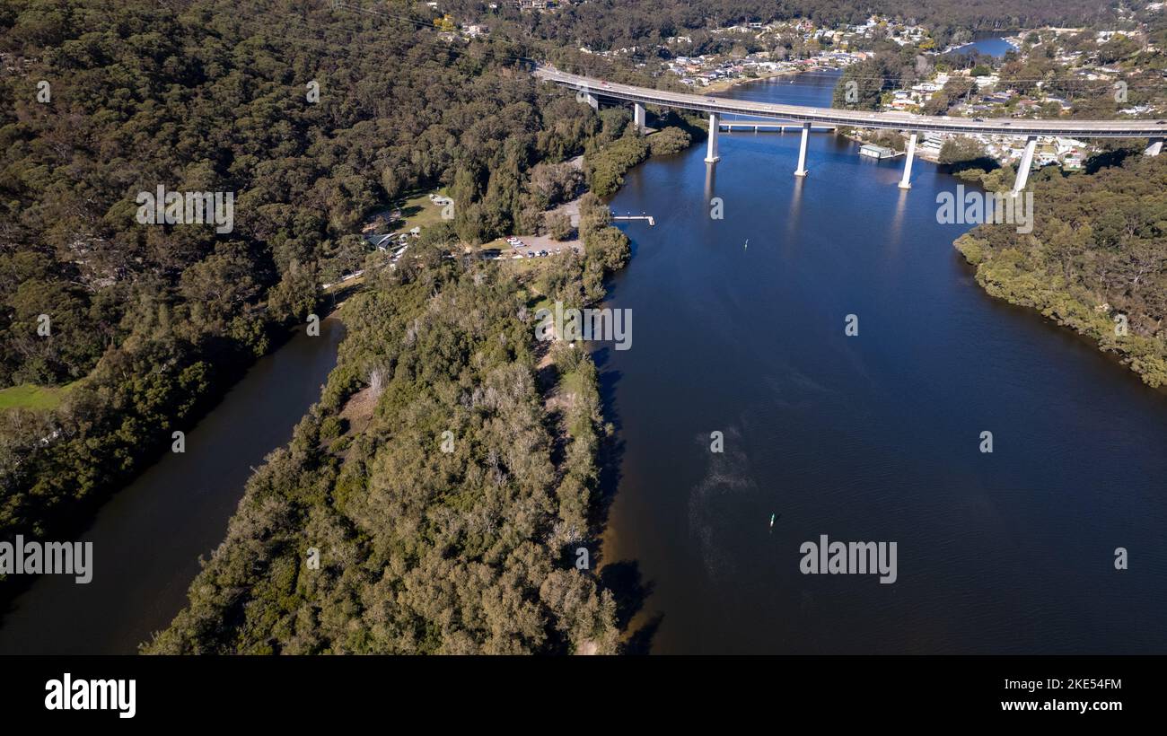 Aerial view of Woronora River surrounded by lush greenery and Woronora ...
