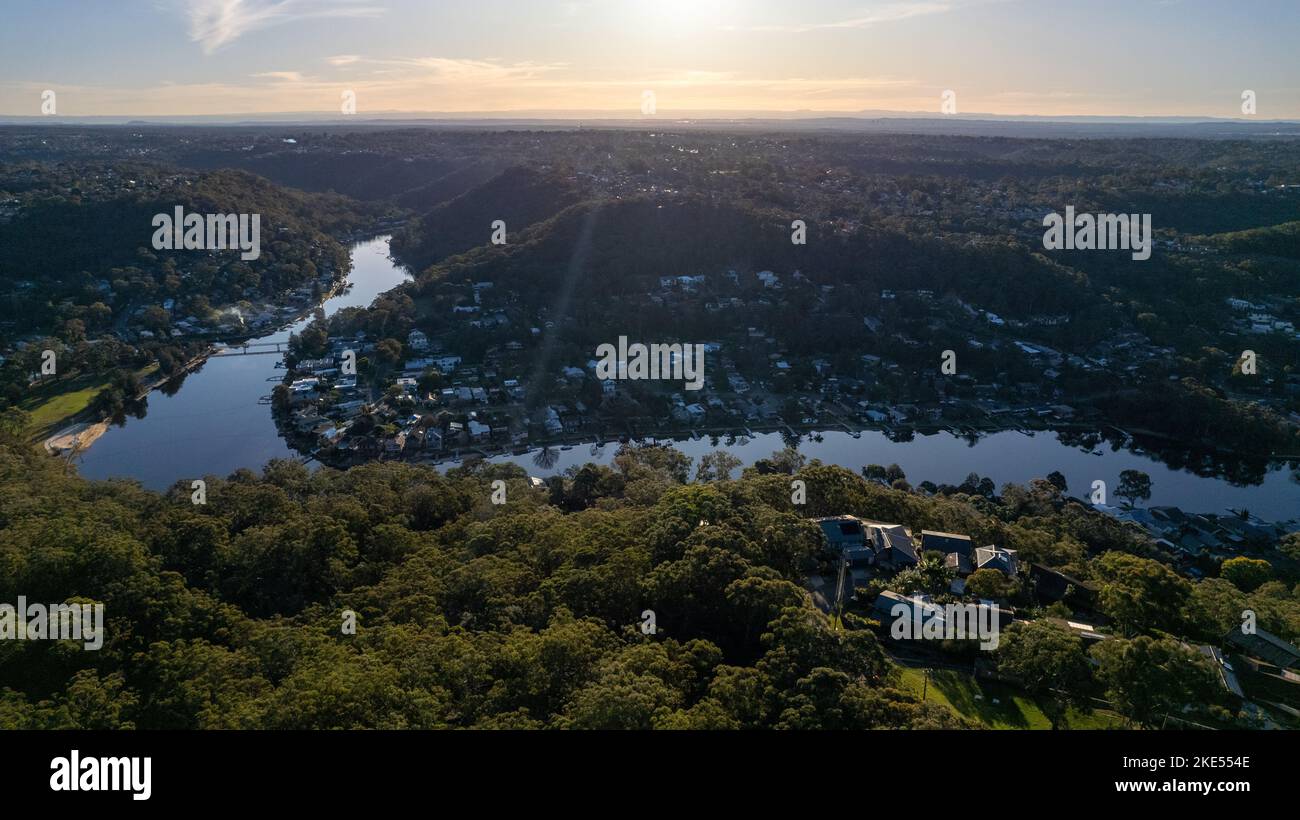 Aerial view of Woronora River surrounded by lush greenery and Woronora ...