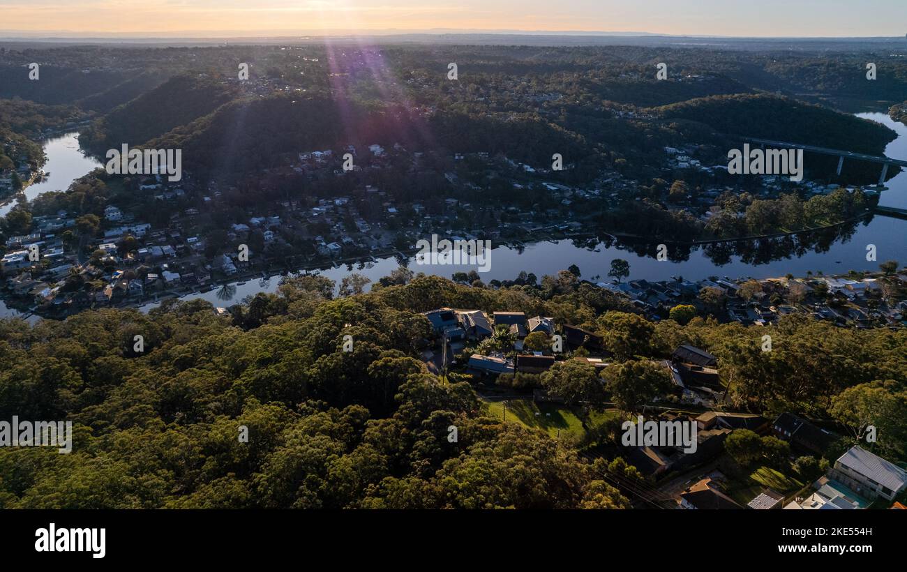 Aerial view of Woronora River surrounded by lush greenery and Woronora ...