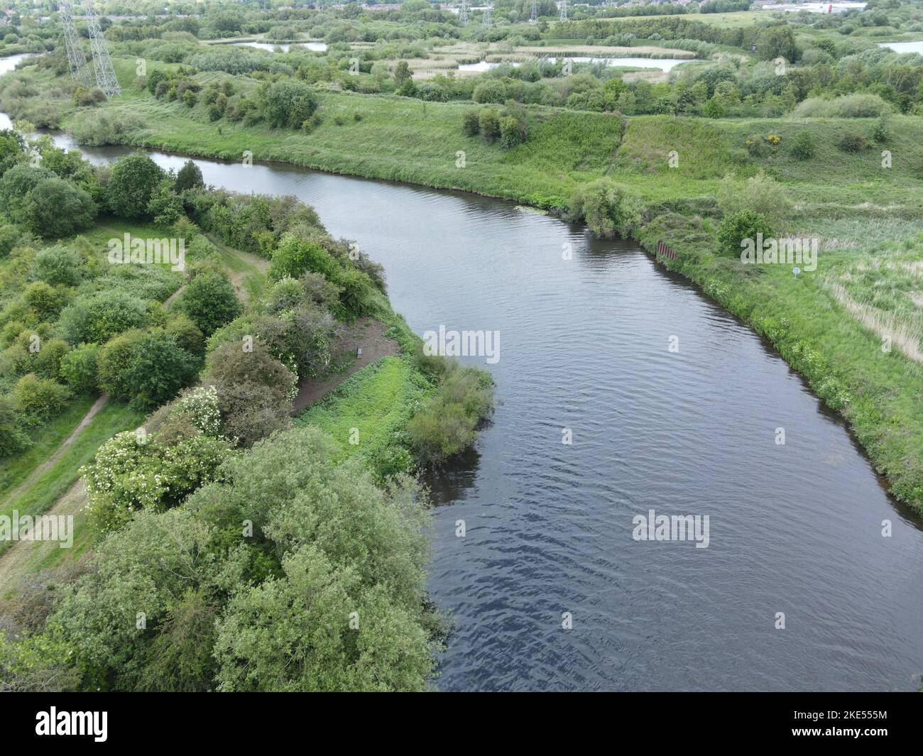 An aerial view of a meander in the River Mersey with Woolston Eyes ...