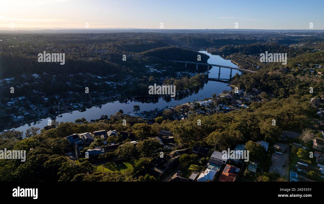 Aerial view of Woronora River surrounded by lush greenery and Woronora ...
