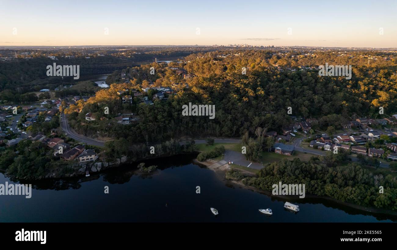 Aerial view of Woronora River surrounded by lush greenery in Sutherland ...