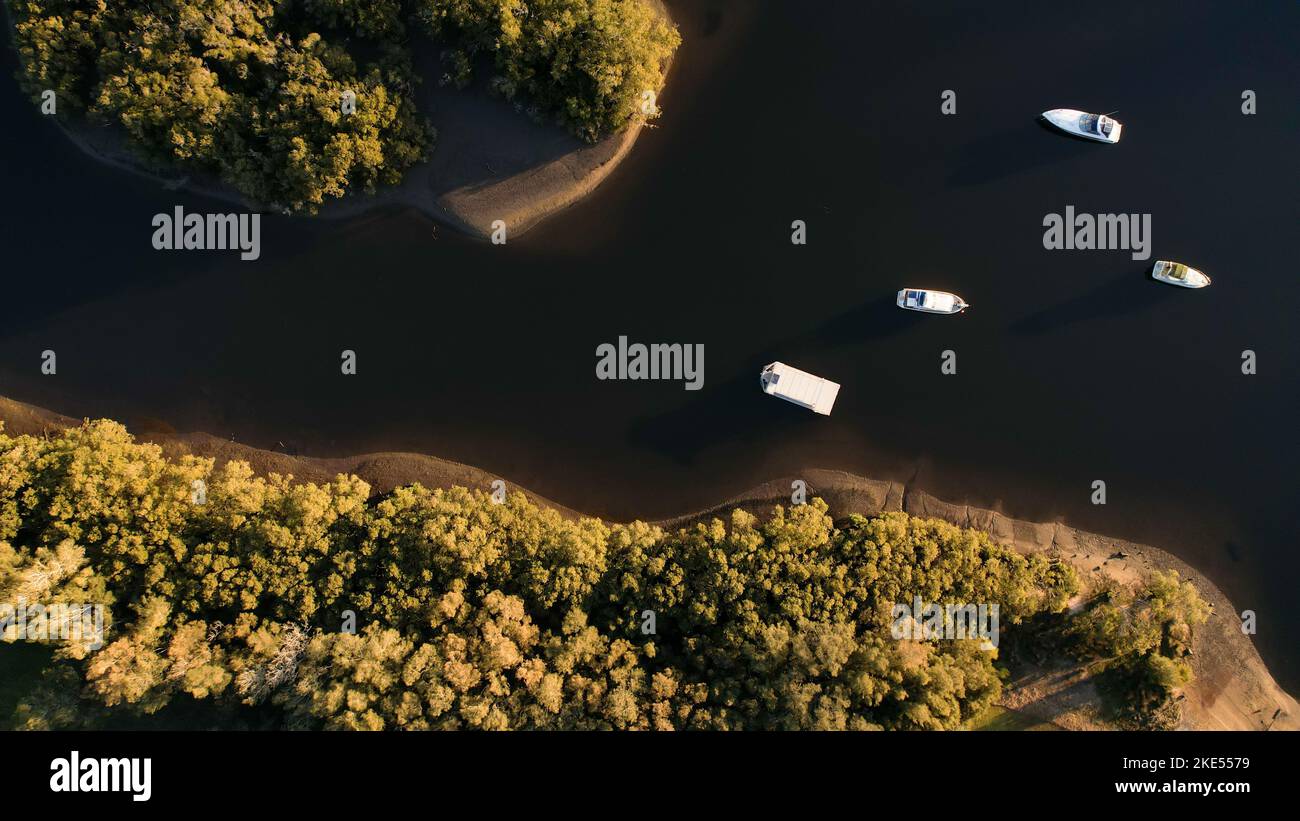 Aerial view of Woronora River surrounded by lush greenery in Sutherland ...
