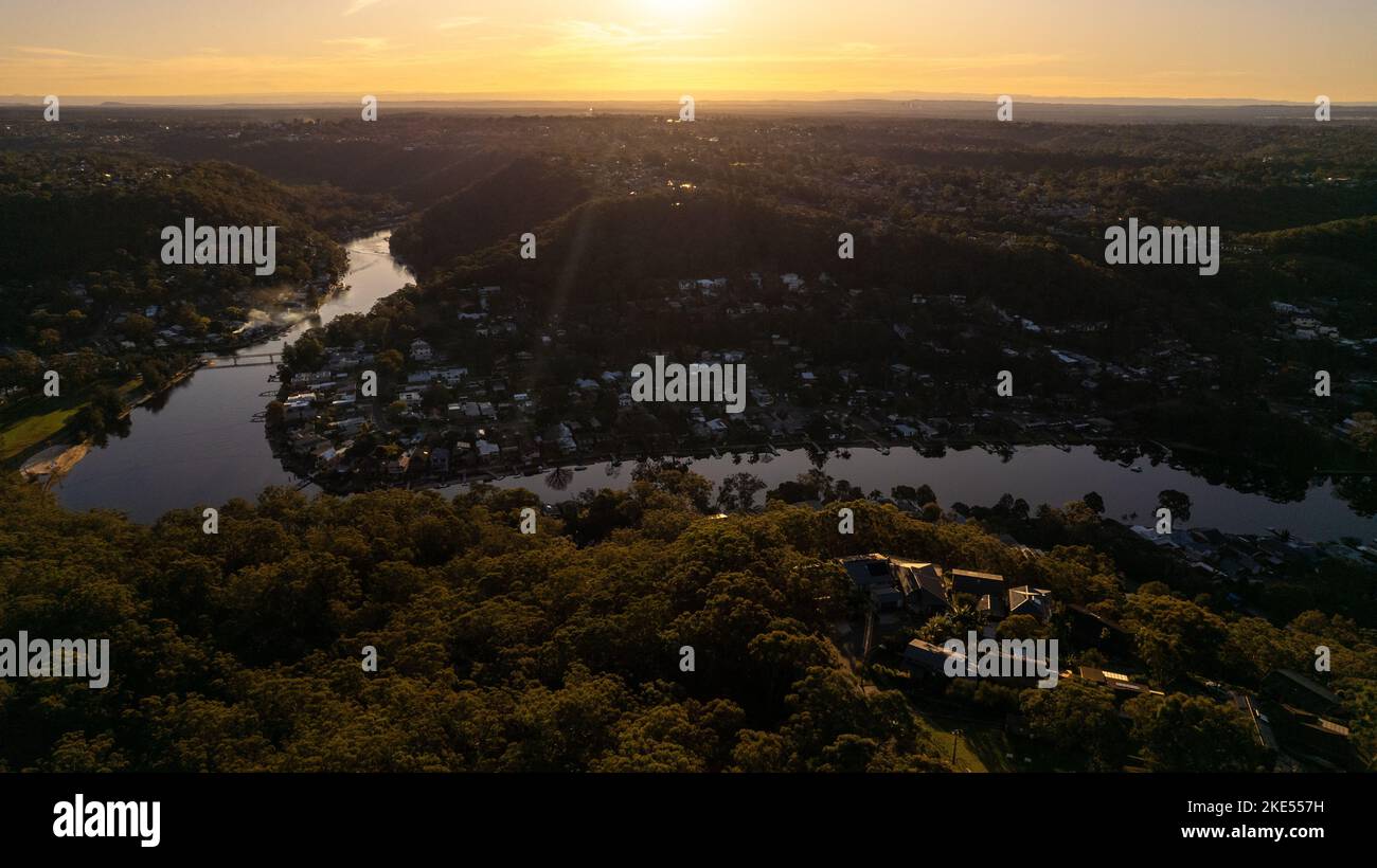 Aerial view of Woronora River surrounded by lush greenery and Woronora ...