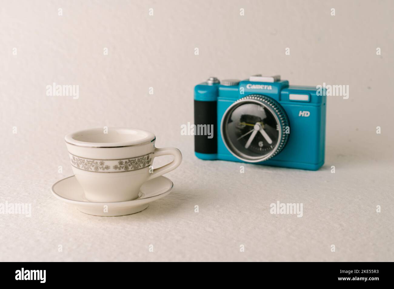 Cup of coffee with a clock on white background Stock Photo - Alamy