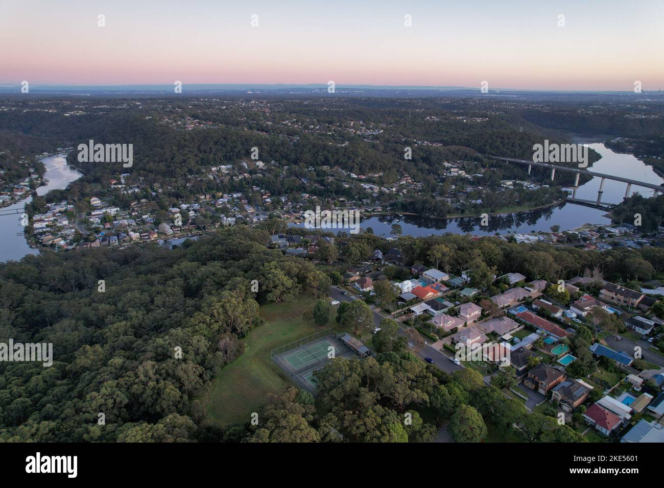 Aerial view of Woronora River surrounded by lush greenery and Woronora ...