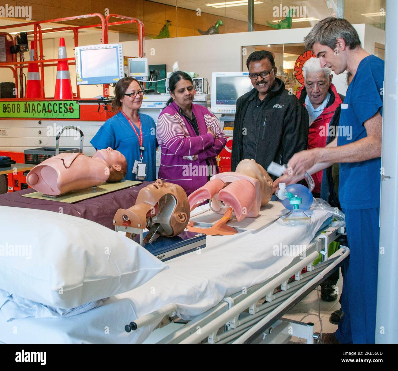 A doctor demonstrates various treatments with plastic mannequins in the ...