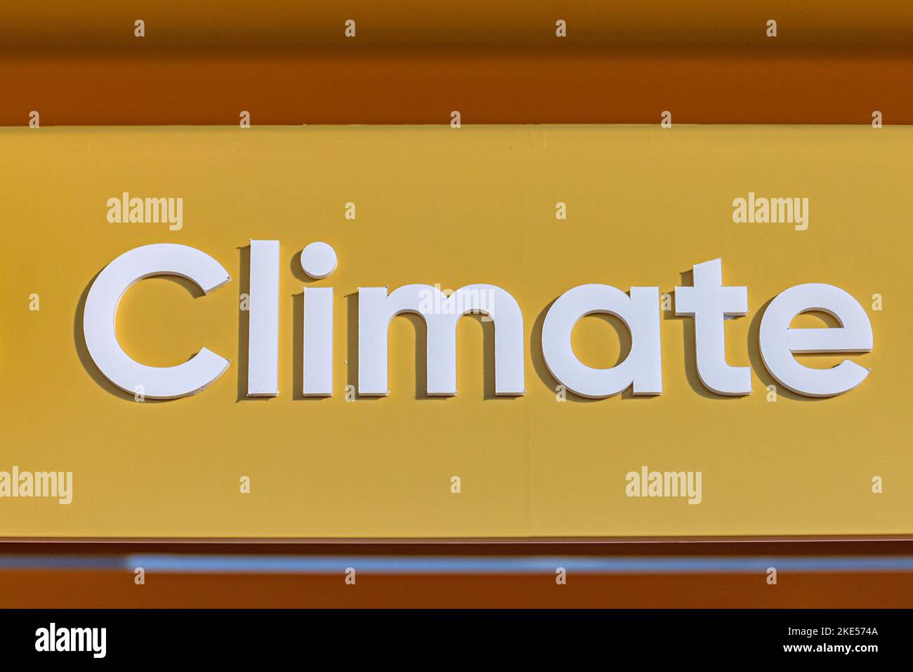 Sign Climate White 3d Letters at Yellow Wall Stock Photo - Alamy