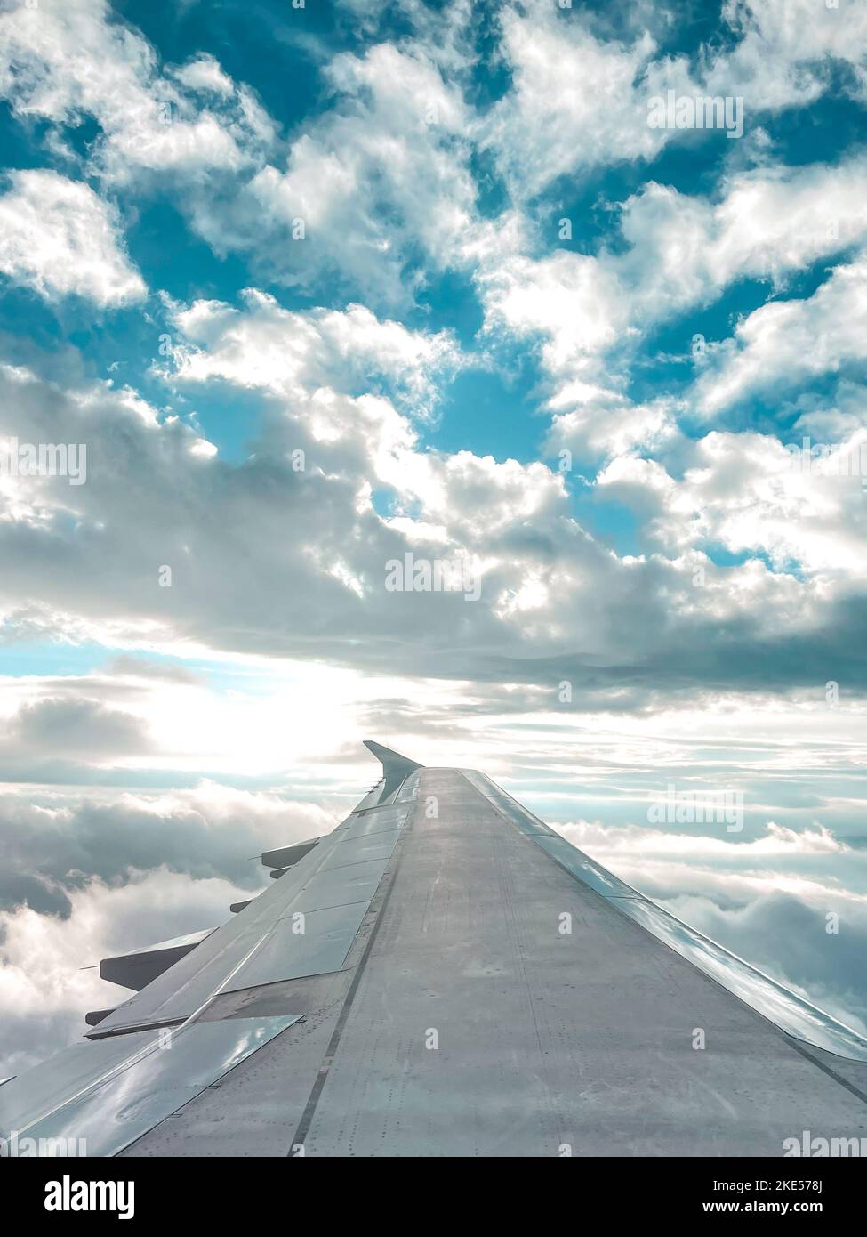 A vertical shot from inside an airplane of the airplane wing and the ...