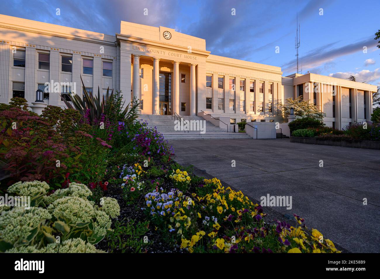 The facade of Linn county courthouse in Albany, Oregon at golden hour ...
