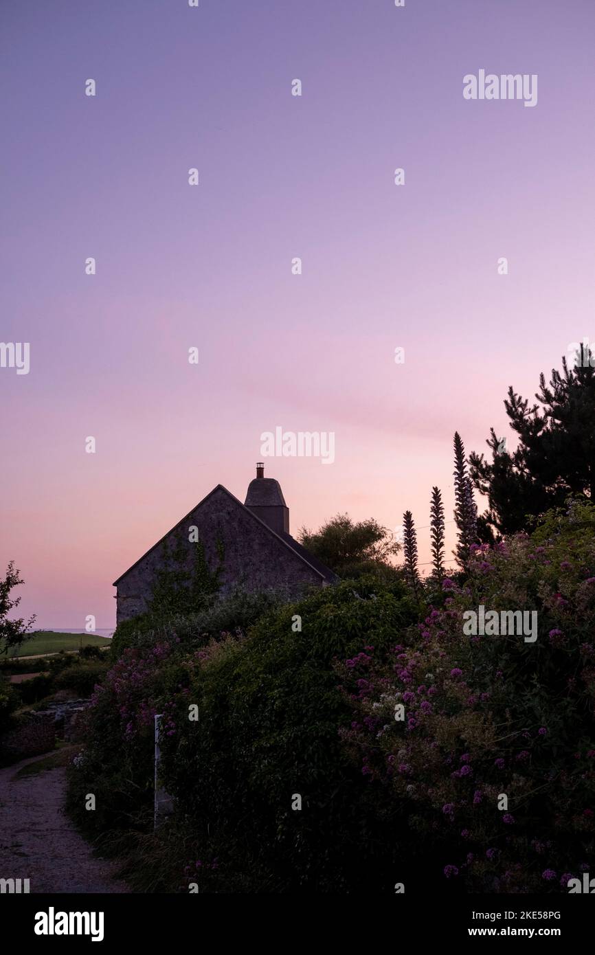 Country cottage in Devon, at dusk Stock Photo - Alamy