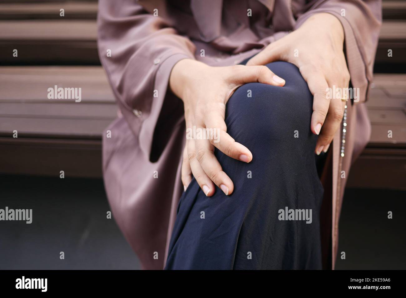 Close up on women suffering knee joint pain Stock Photo - Alamy