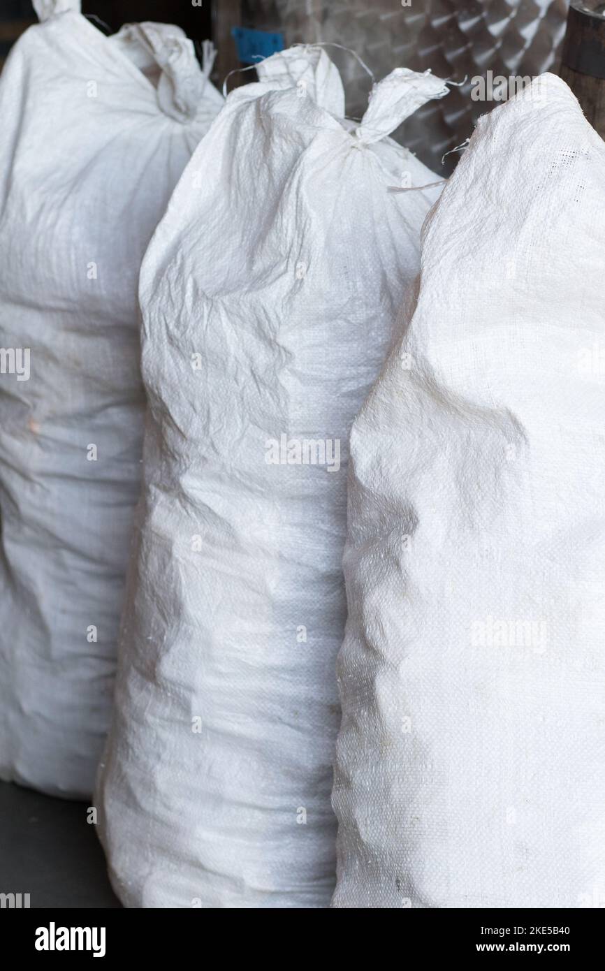 three poly bags full of produce. food production Stock Photo - Alamy
