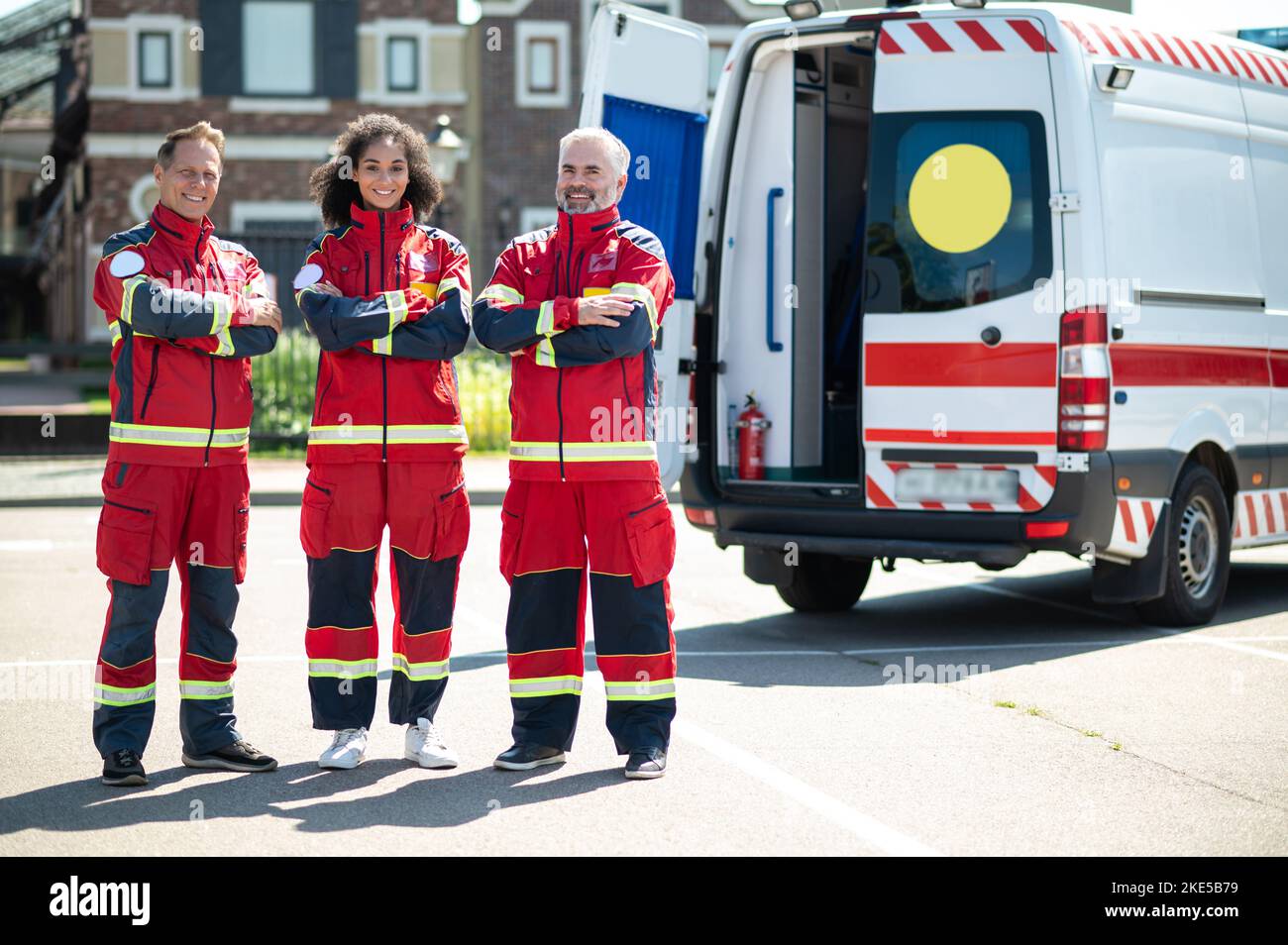 Joyous paramedics in the uniforms standing outdoors Stock Photo - Alamy