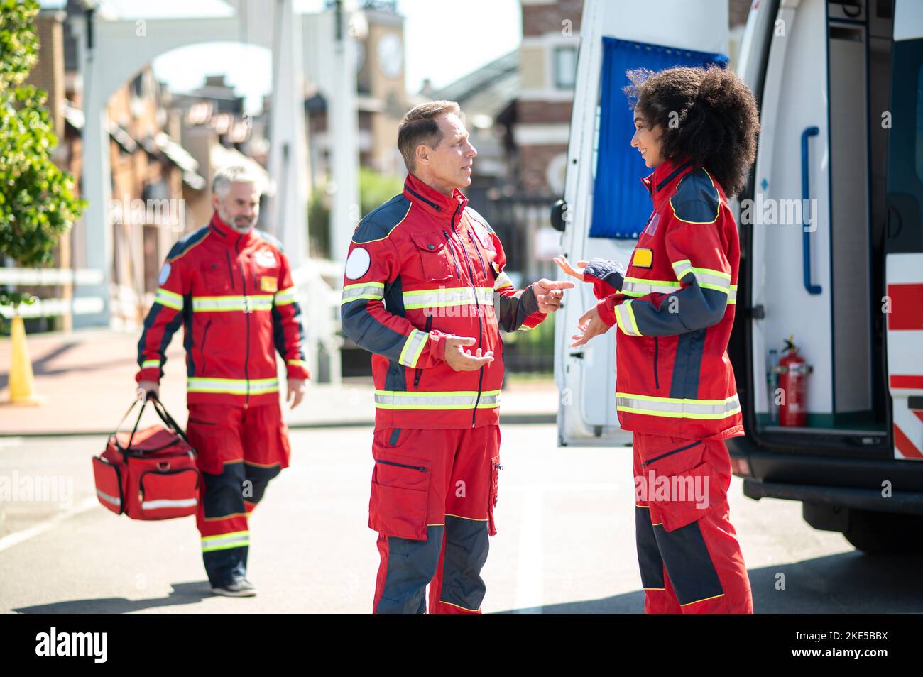 Paramedical personnel having a conversation before the work shift Stock ...
