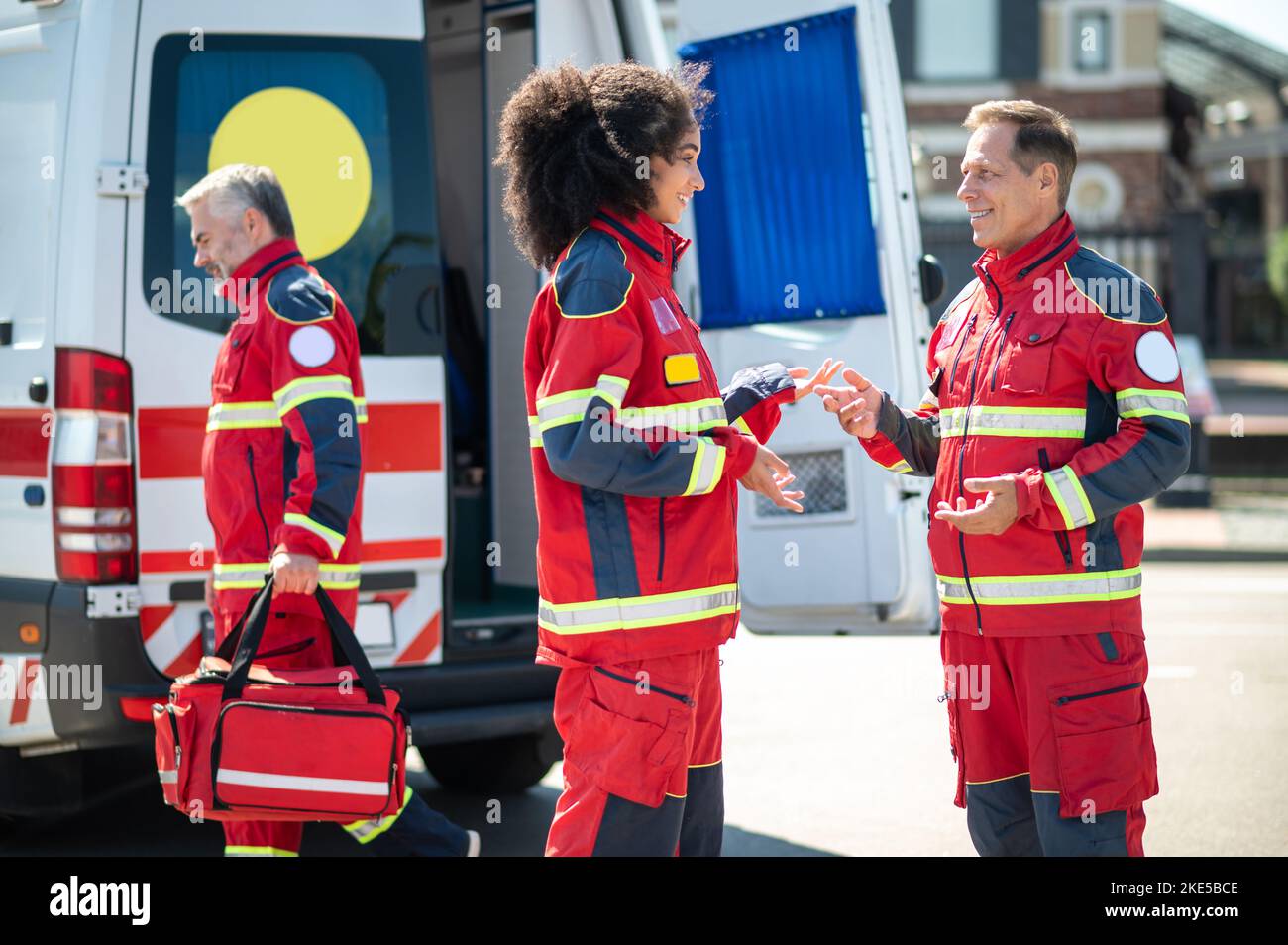 Paramedical staff communicating near the ambulance van Stock Photo - Alamy