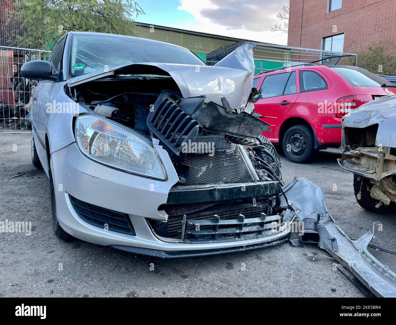 View of the front of a car badly damaged during a car accident. In this ...