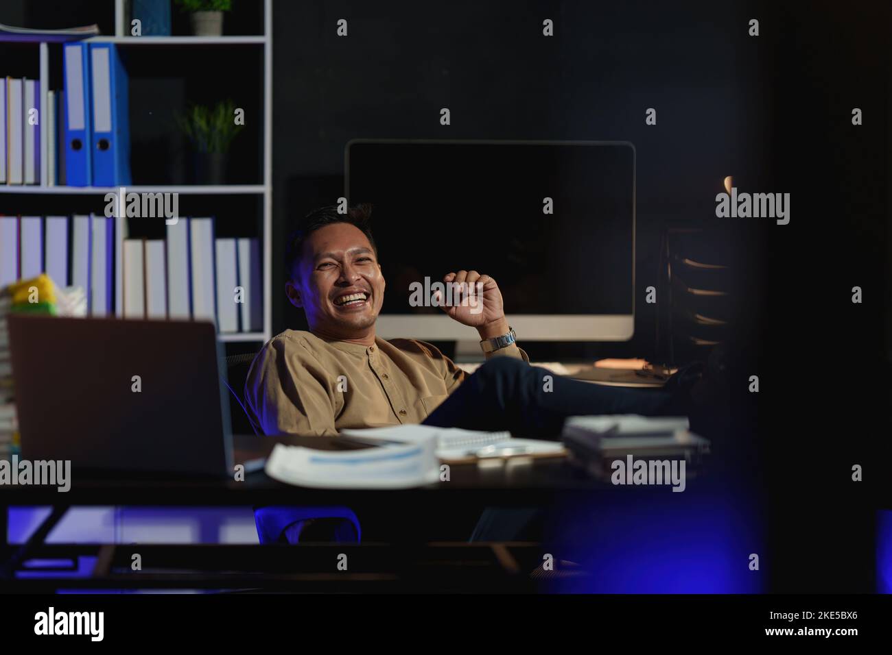 Asian business man working over time at night. business account and ...