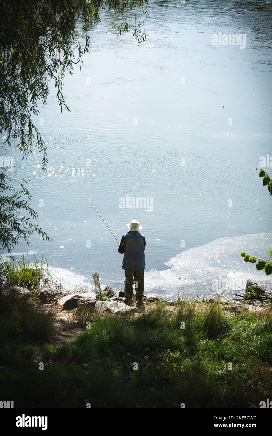 Man fishing in polluted water hi-res stock photography and images - Alamy