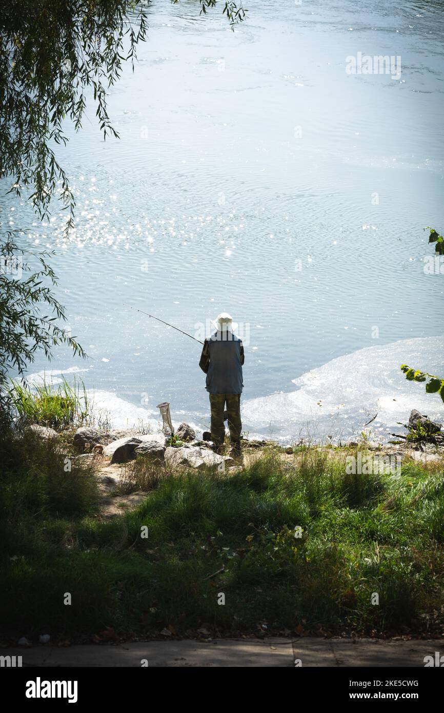 Man fishing in polluted water hi-res stock photography and images - Alamy