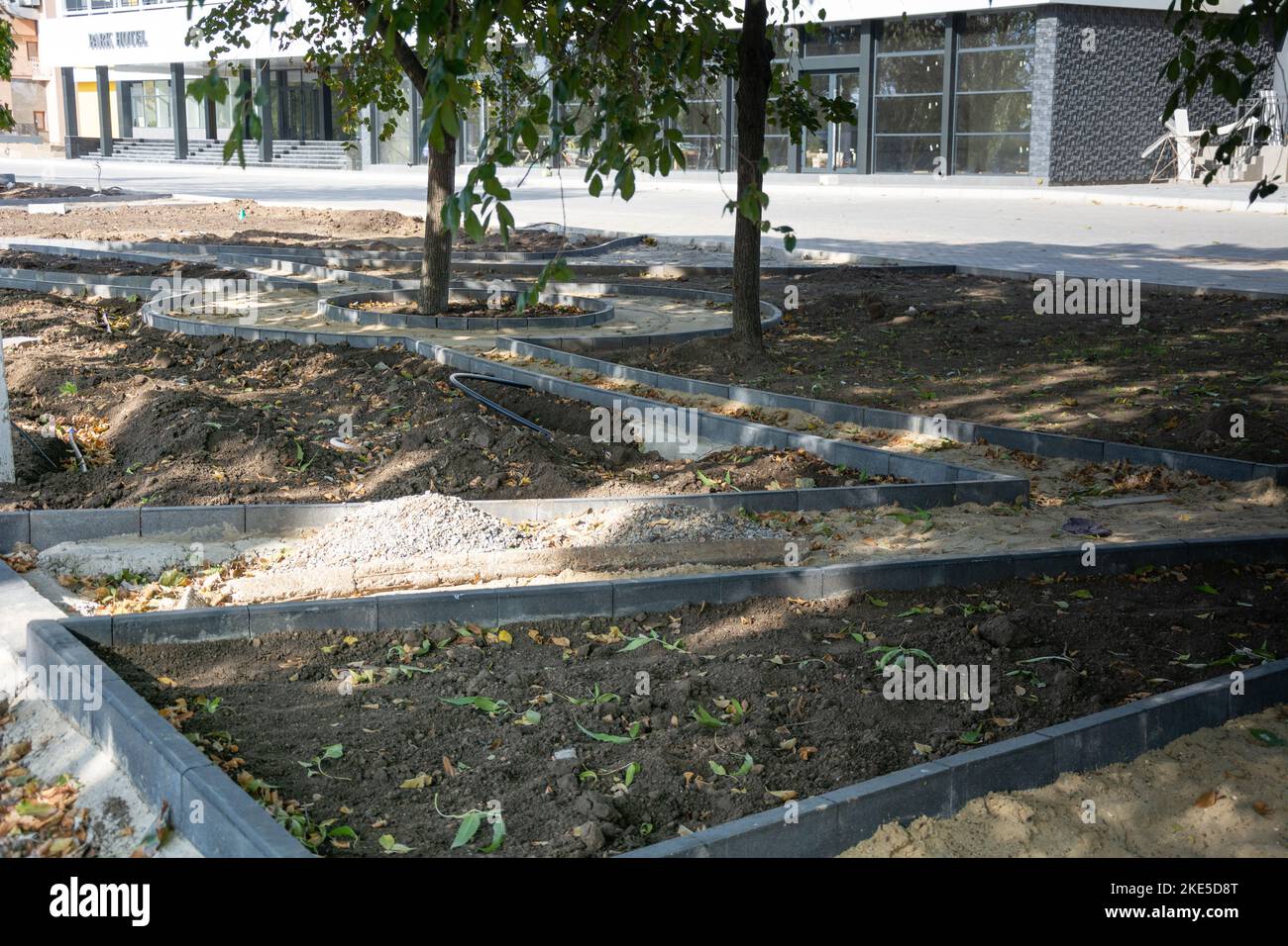 Construction of a park path. Borders along the park path, drip ...