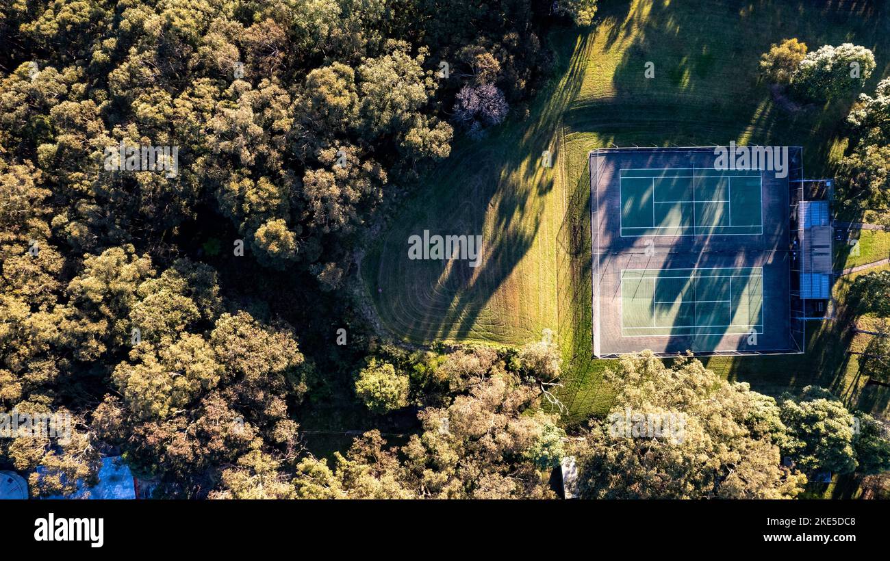 Aerial top view of Grand Parade Tennis Courts, surrounded by dense ...
