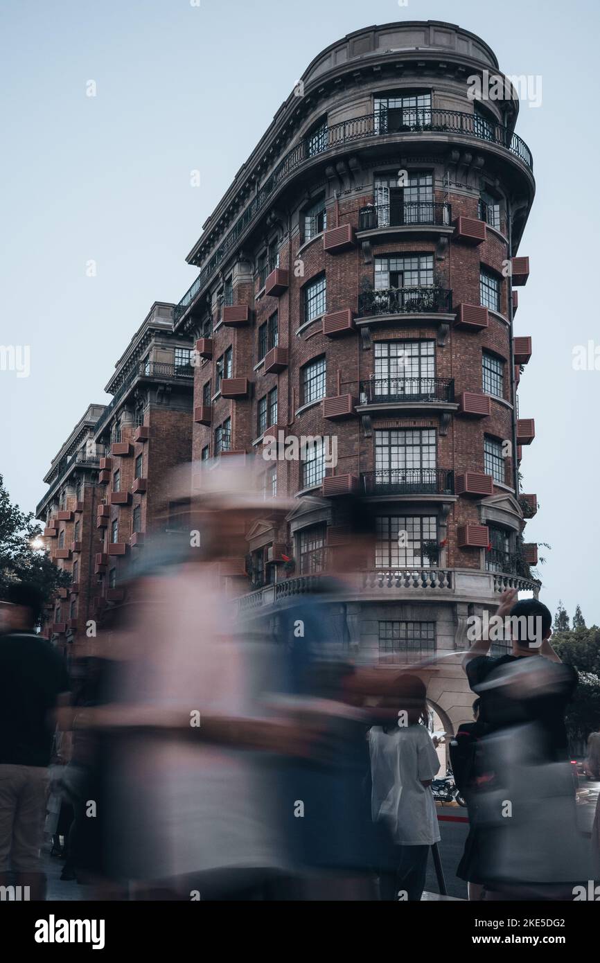 A vertical long exposure of tourists walking by the famous Wukang ...