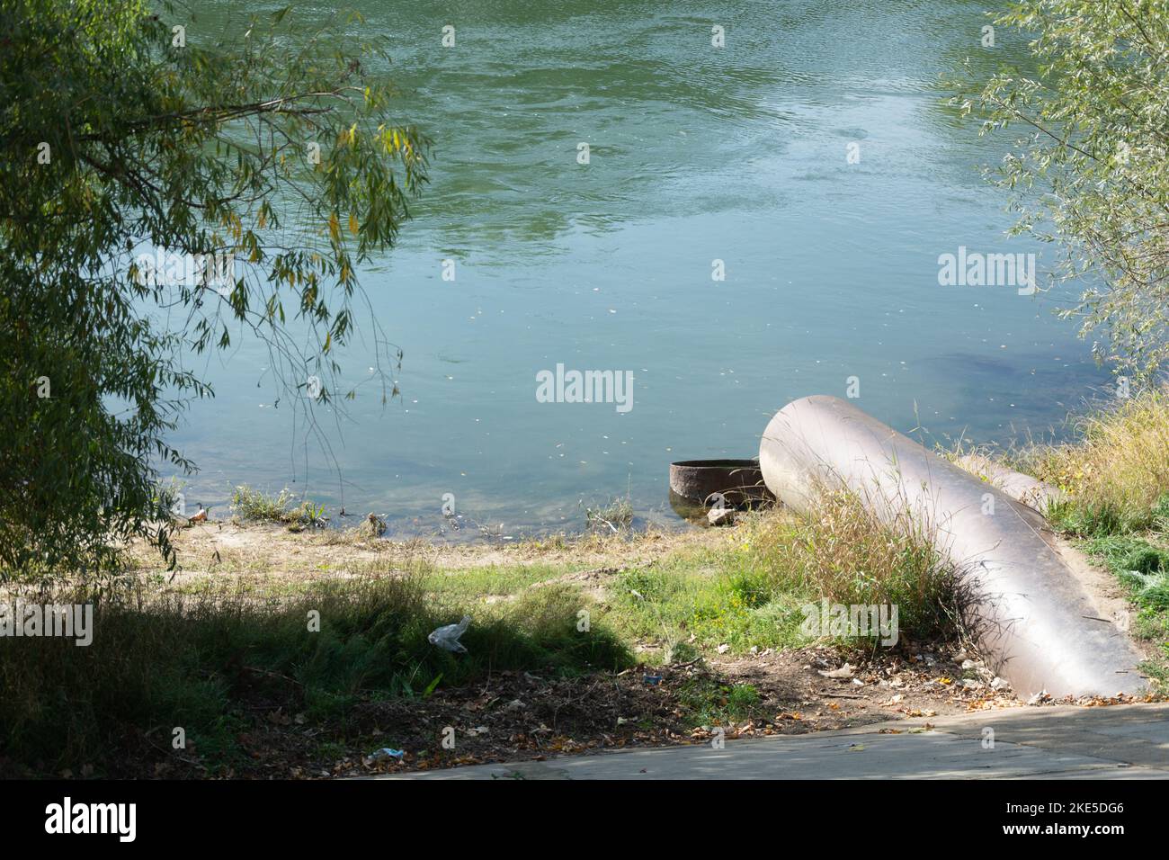 Sewage from the sewer polluting a lake or water gushing from the sewer ...