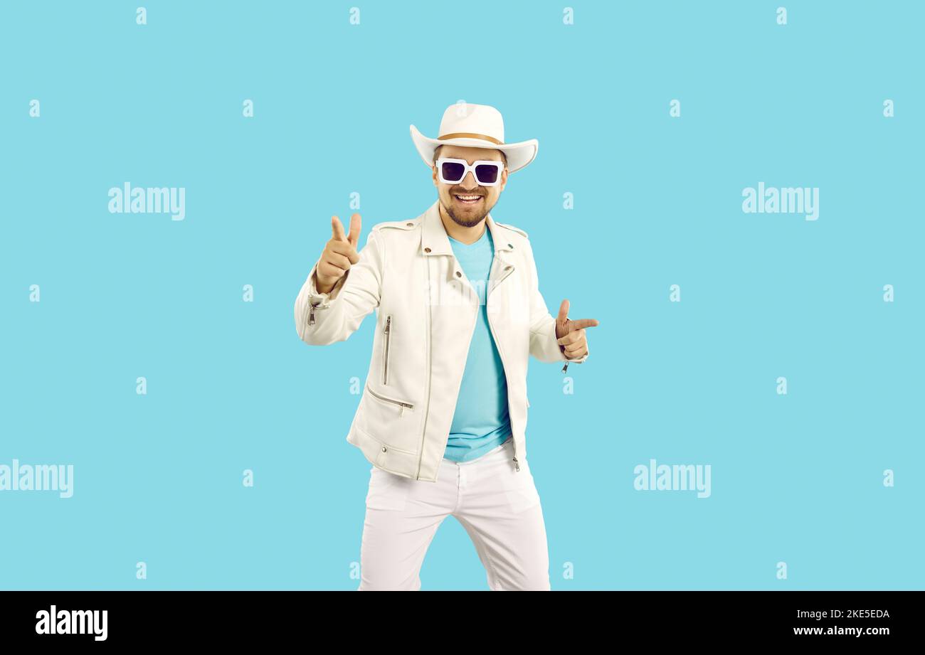 Smiling man in cowboy suit dance in studio Stock Photo - Alamy
