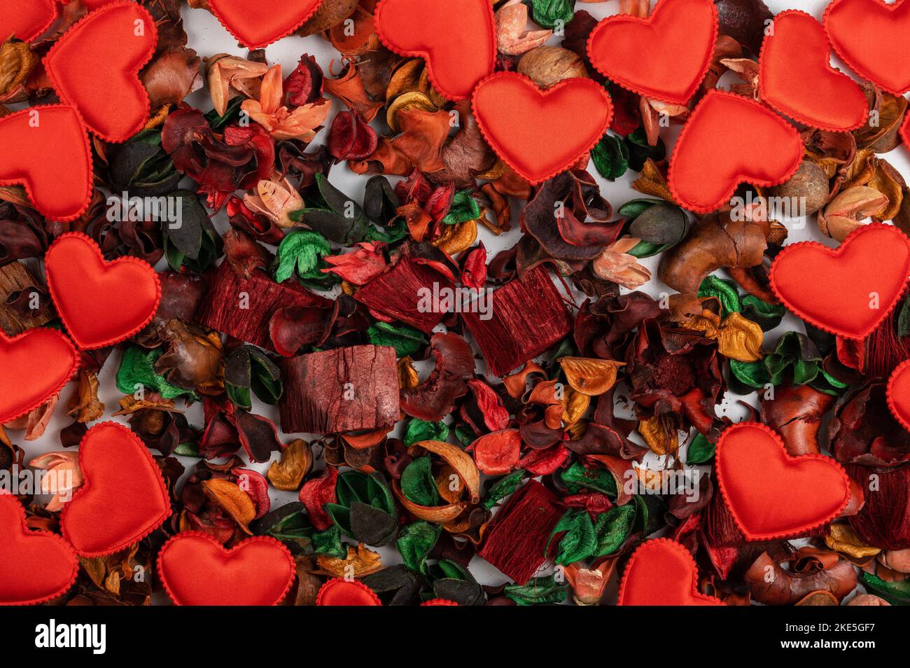 Different dry flowers with red hearts background. Valentines day or ...