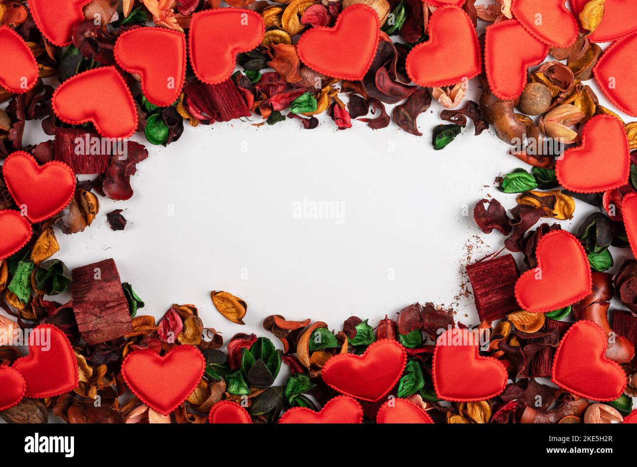 Different dry flowers with red hearts background. Valentines day or ...