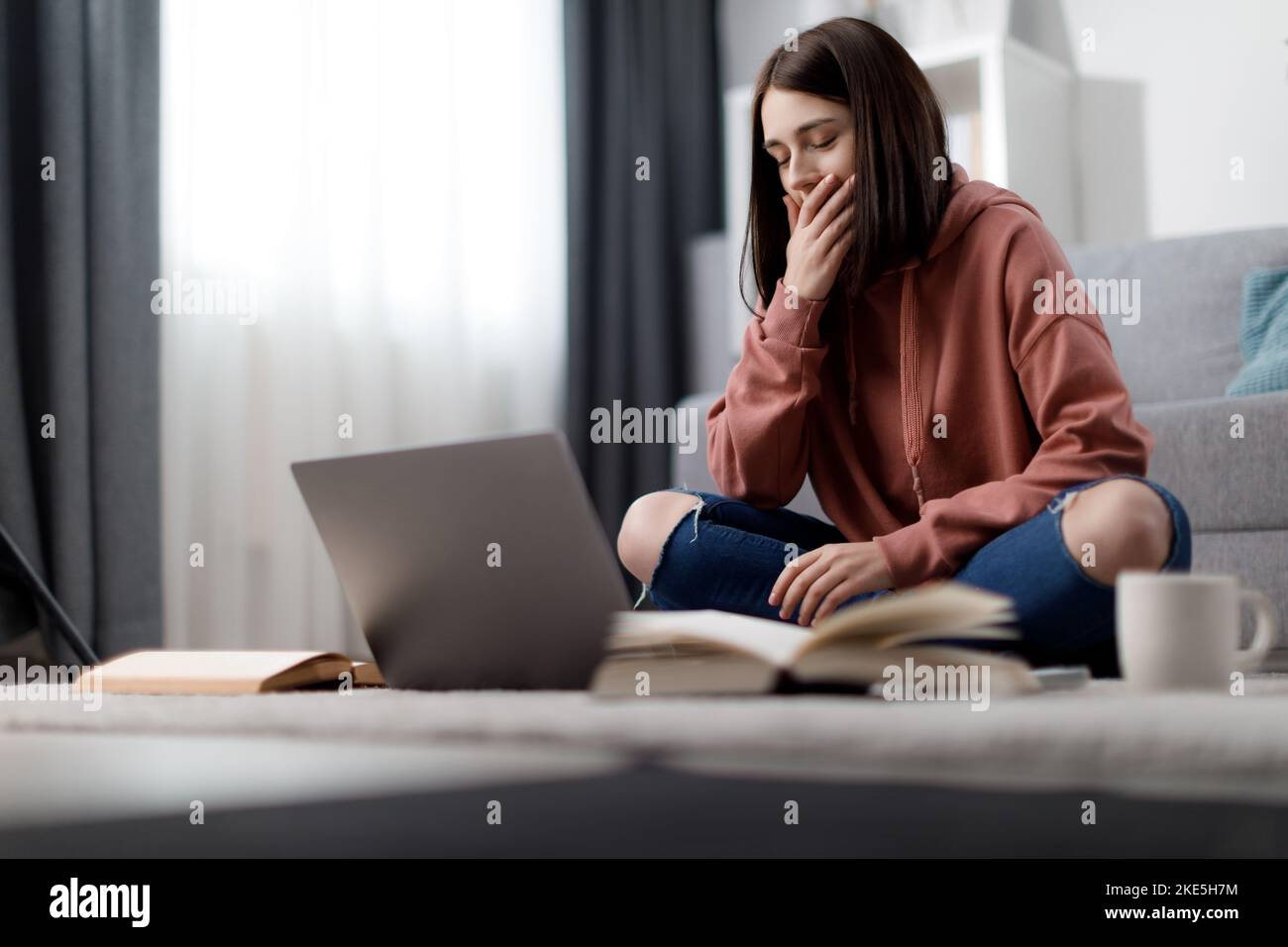 Student with laptop at home Stock Photo - Alamy