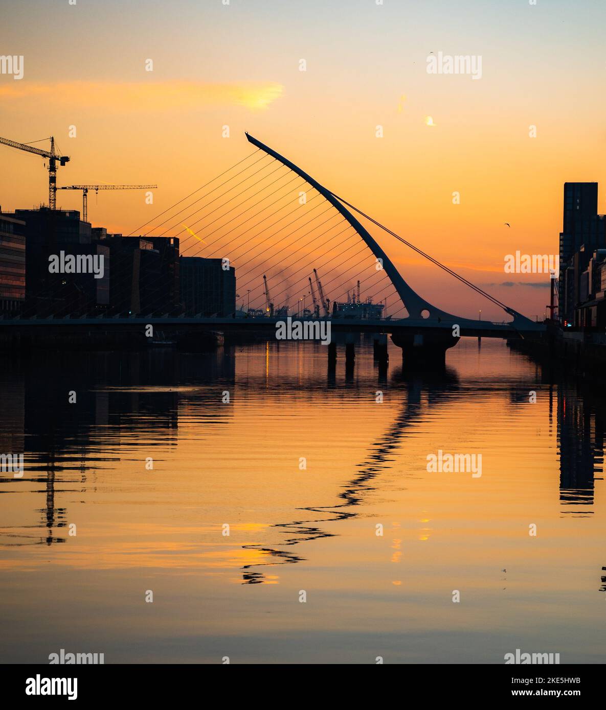 A beautiful soft sunset over the Dublin city with a bridge over the ...