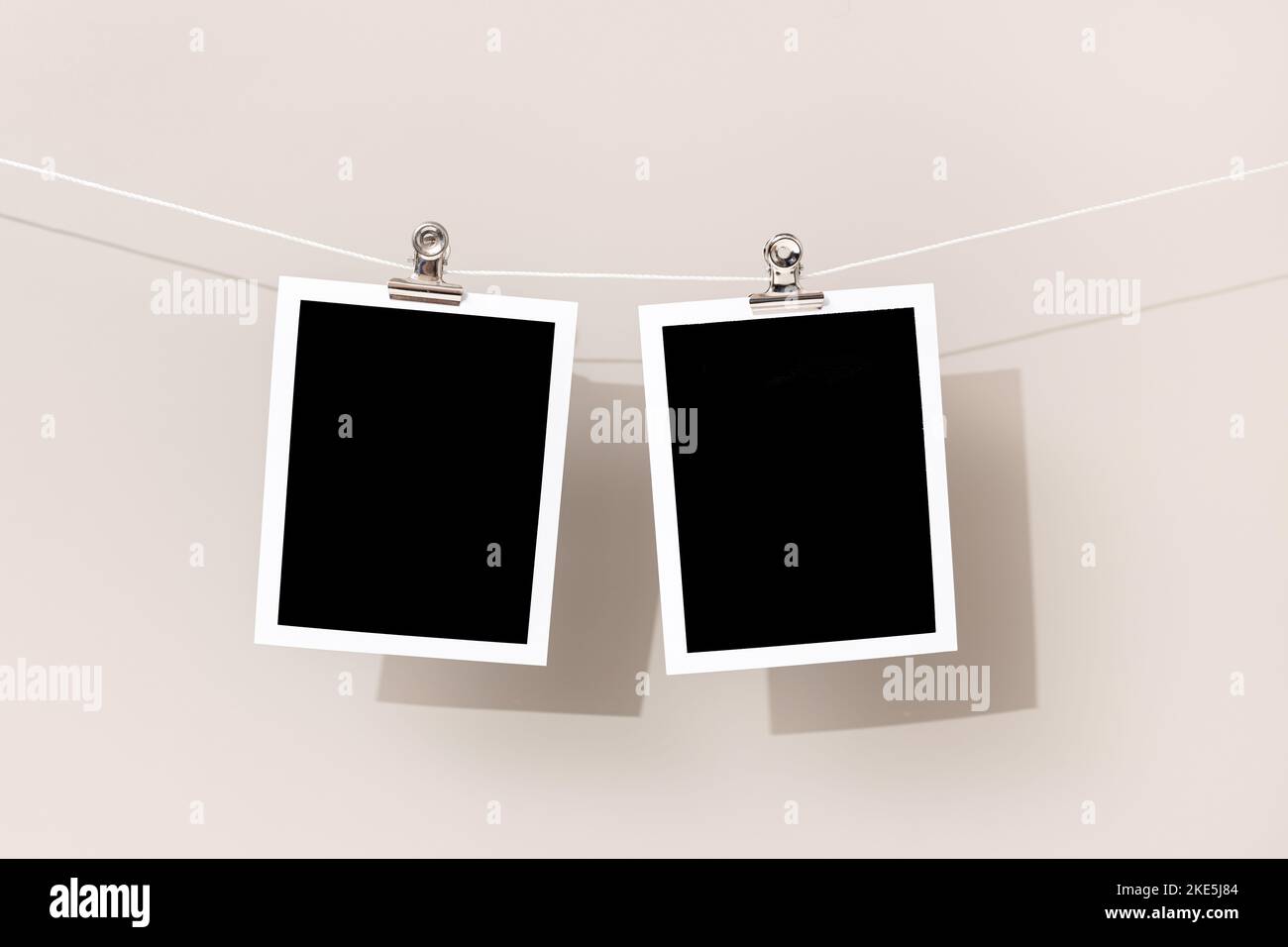 Two Blank Vintage instant photo frame hanging on a rope. Template Stock ...