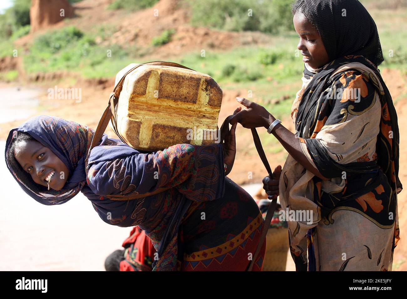 women from ethiopia by a lake to collect drinking water .vvbvanbree ...