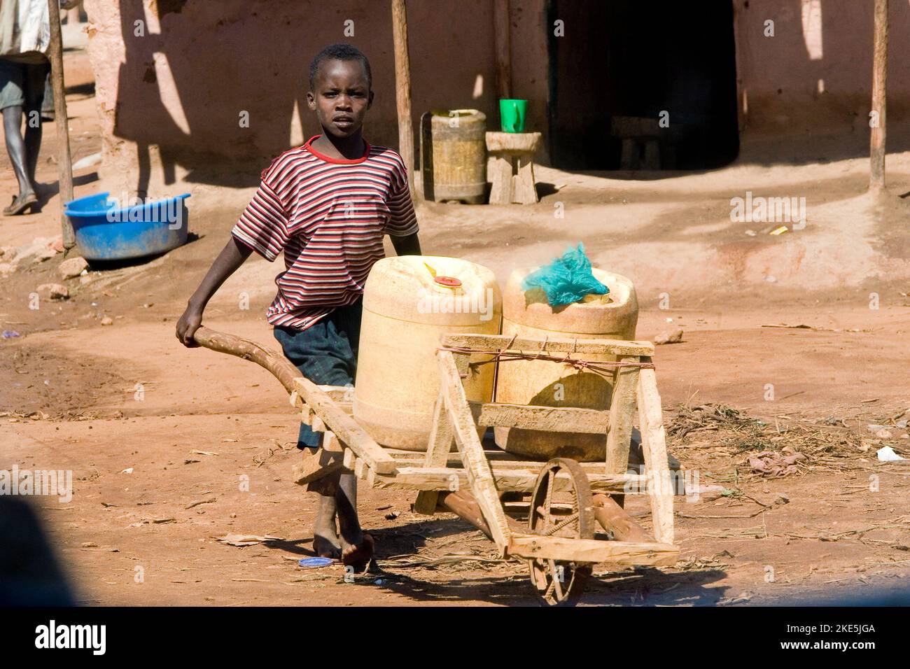 child from ethiopia transported with homemade wheelbarrow water ...
