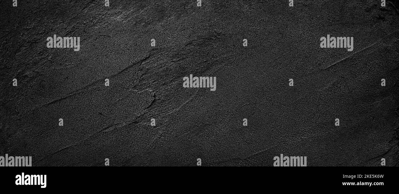 Black or dark gray rough grainy sand texture background Stock Photo - Alamy