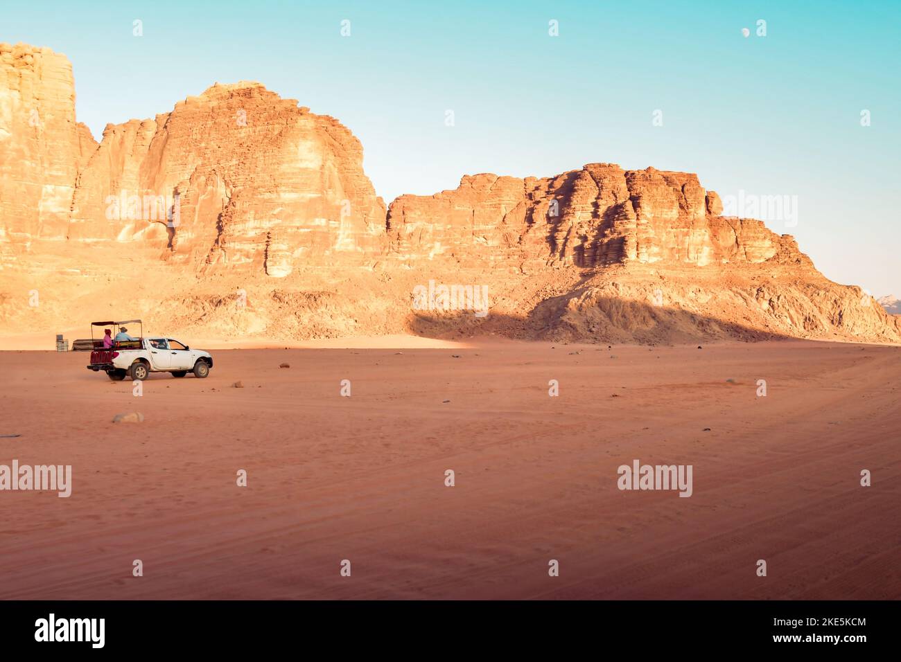 Offroad truck or suv riding dune in famous wadi rum desert at sunset ...