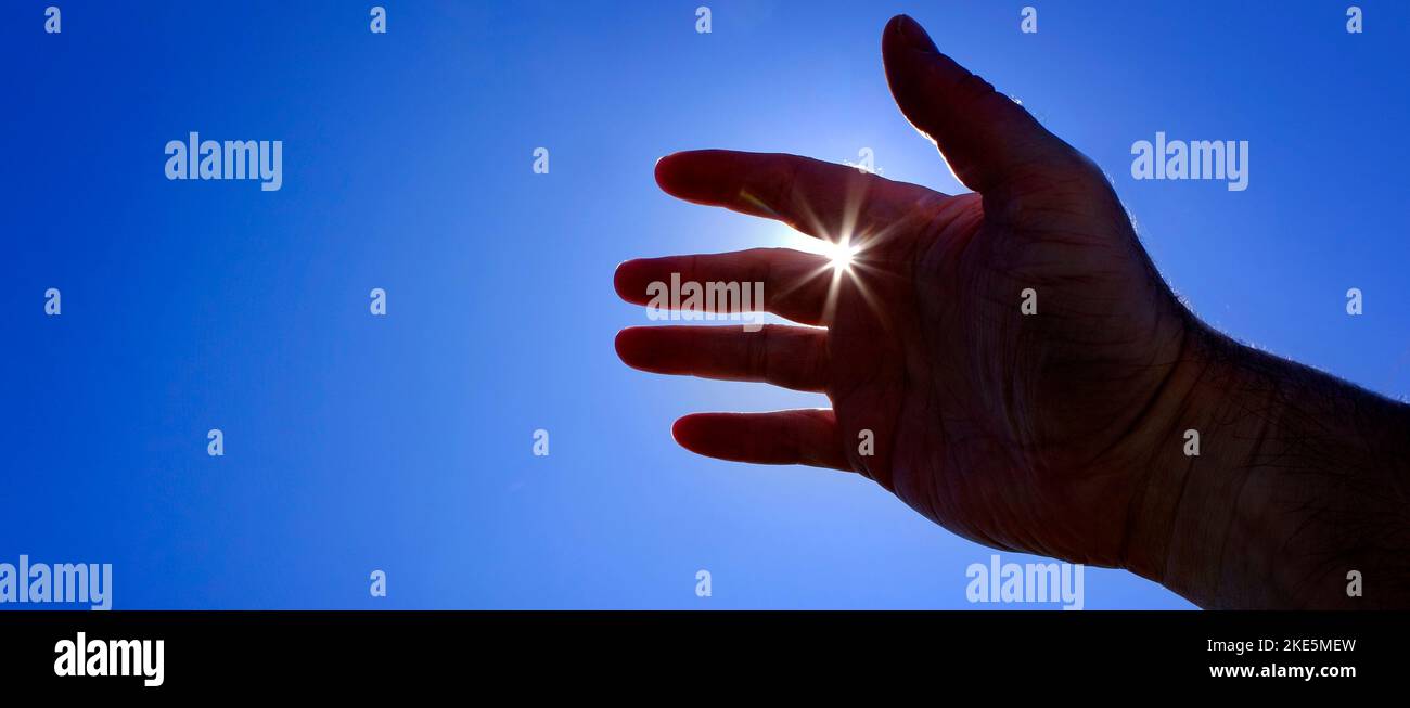 Hand reaching sun hi-res stock photography and images - Alamy