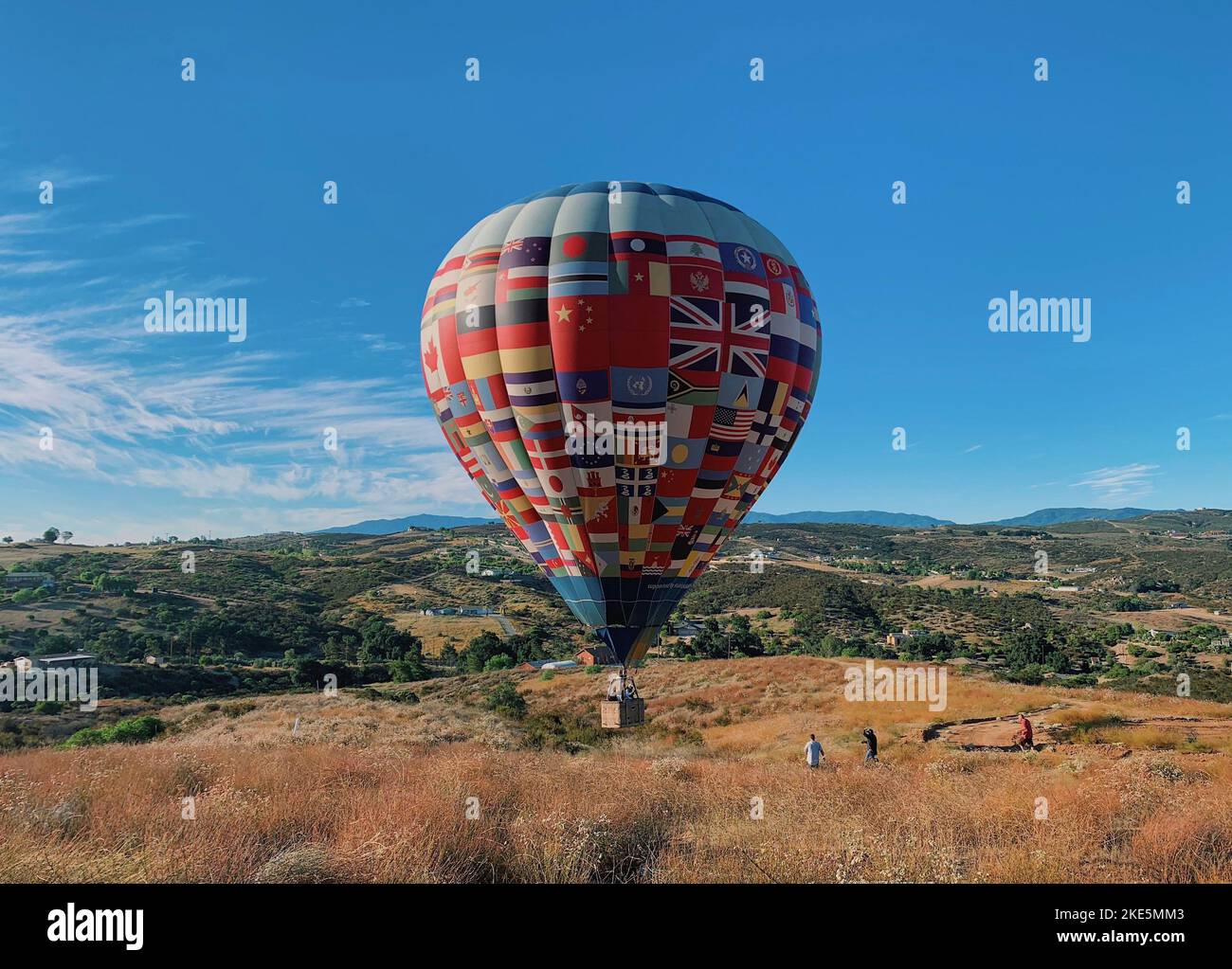 A hot air balloon on the ground ready to float in blue sky Stock Photo ...