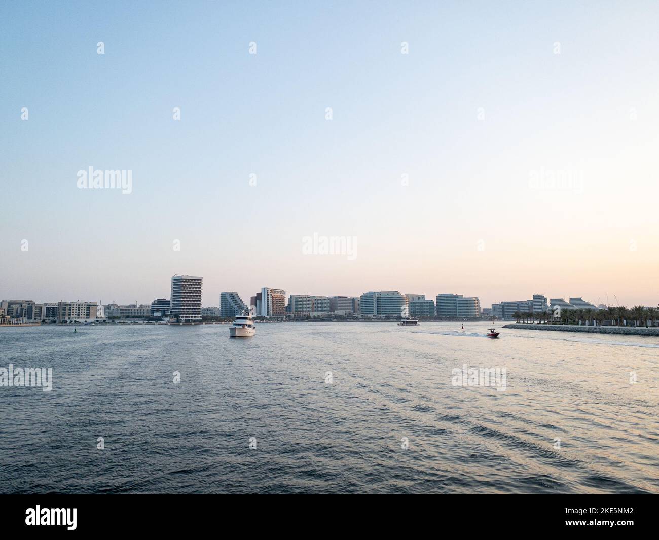 A view of Al Raha Beach, Abu Dhabi, UAE at sunset taken from Yas Island ...