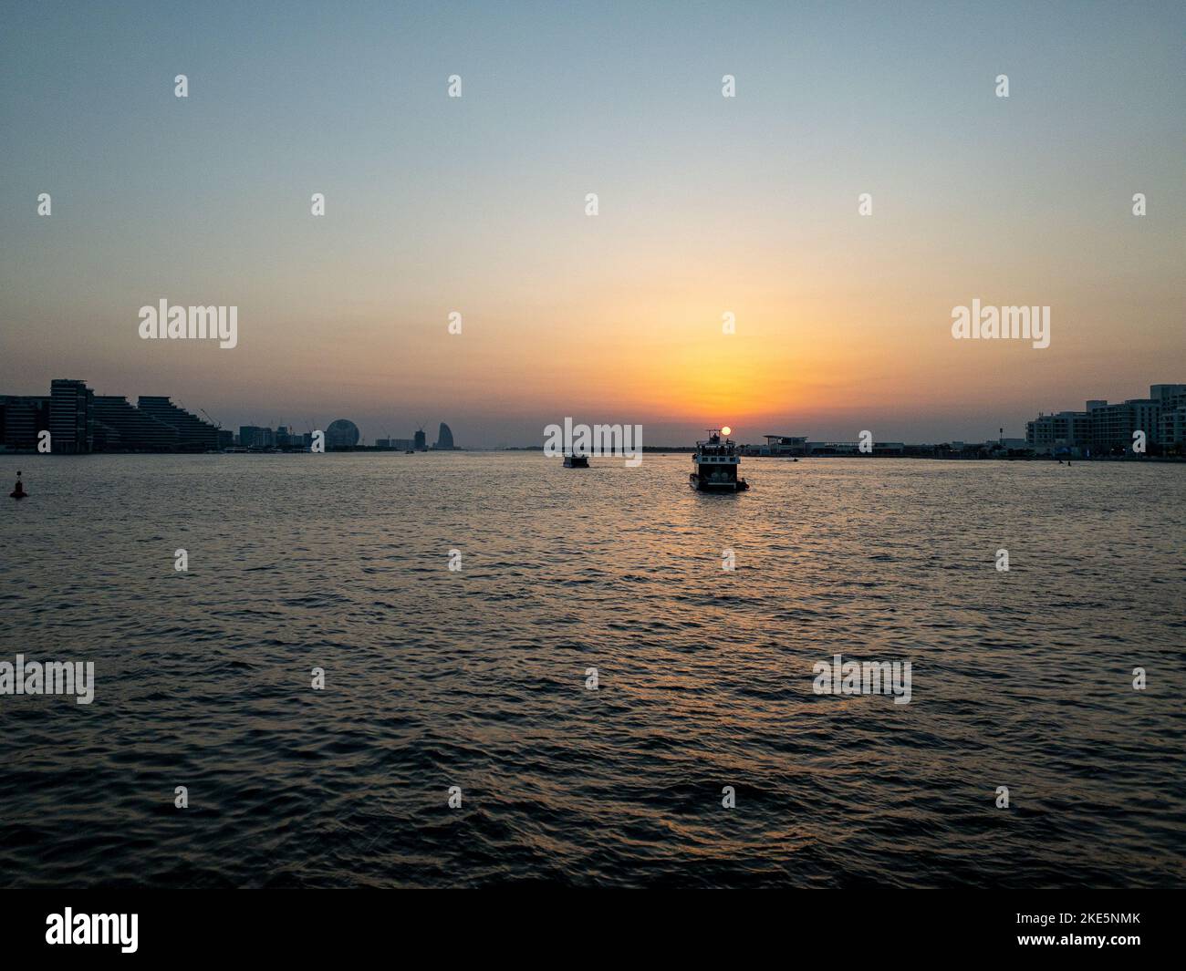 Al Raha Beach, Abu Dhabi as seen from Yas Island, Abu Dhabi at sunset ...