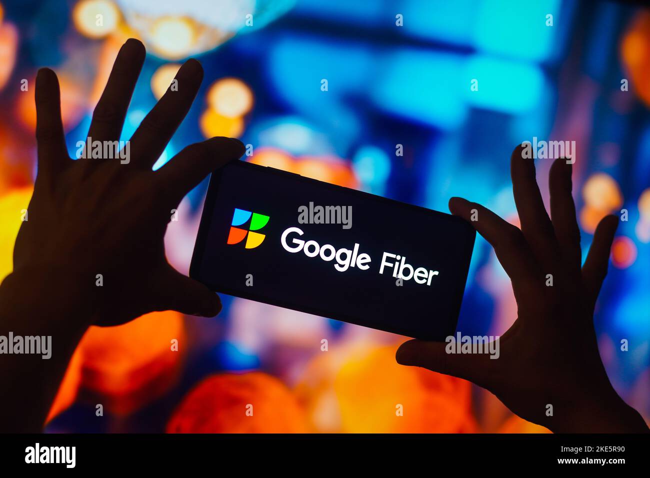 In this photo illustration, the Google Fiber logo is displayed on a ...