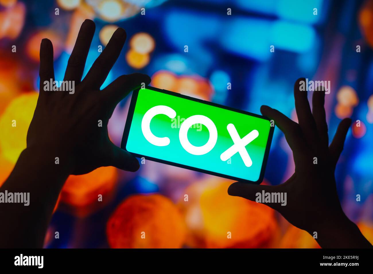 In this photo illustration, the Cox Communications logo is displayed on ...