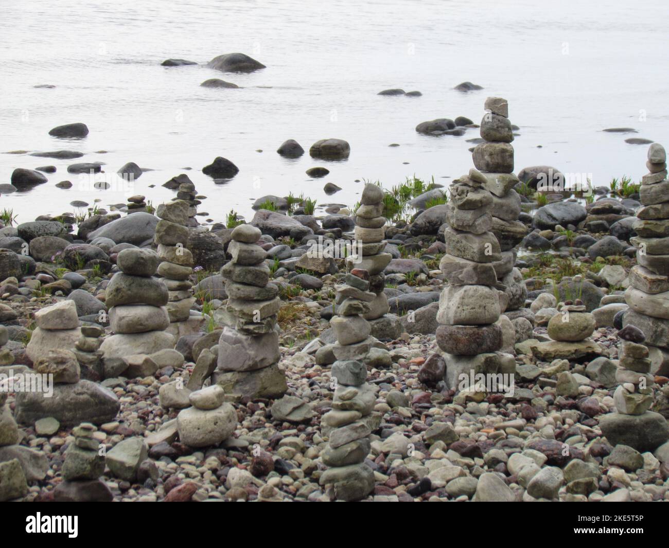 The large stacks of balancing rocks on a lake shore Stock Photo - Alamy