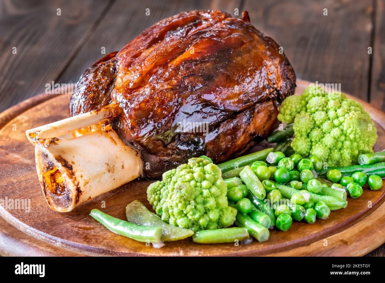 Cooked ham hock on the wooden cutting board Stock Photo - Alamy