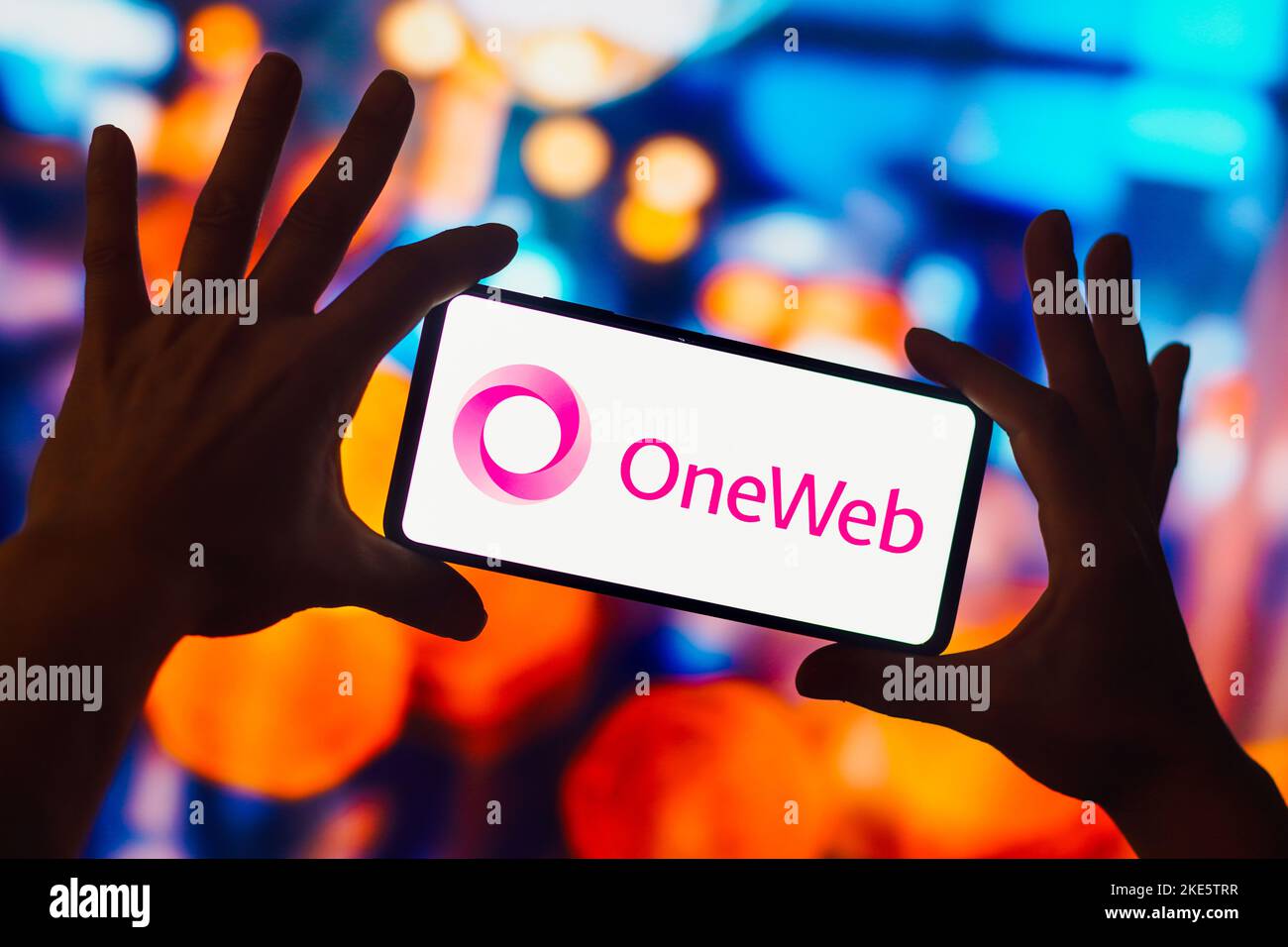 In this photo illustration, the OneWeb logo is displayed on a ...